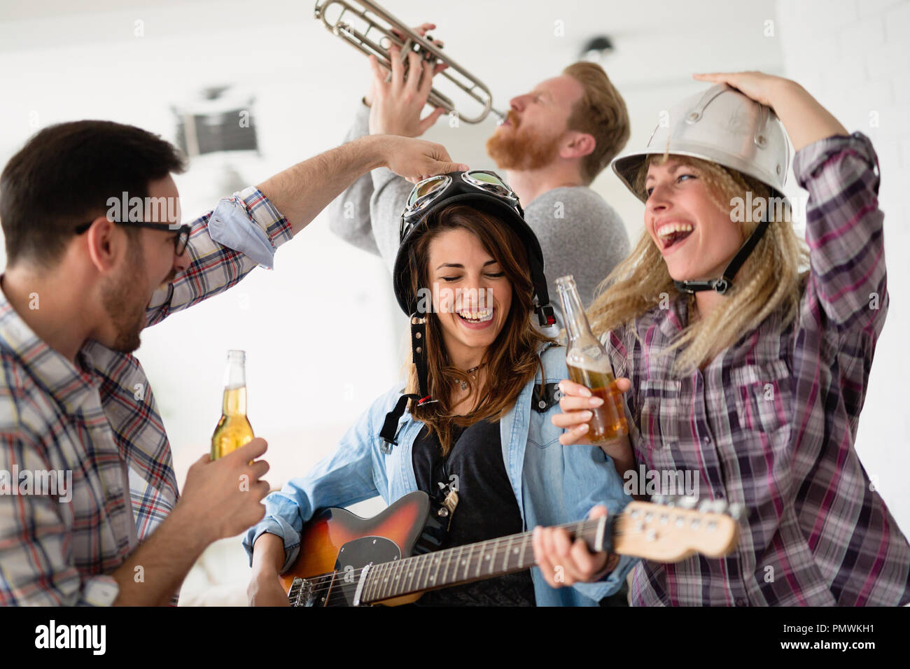Happy group of friends playing instruments and partying Stock Photo - Alamy