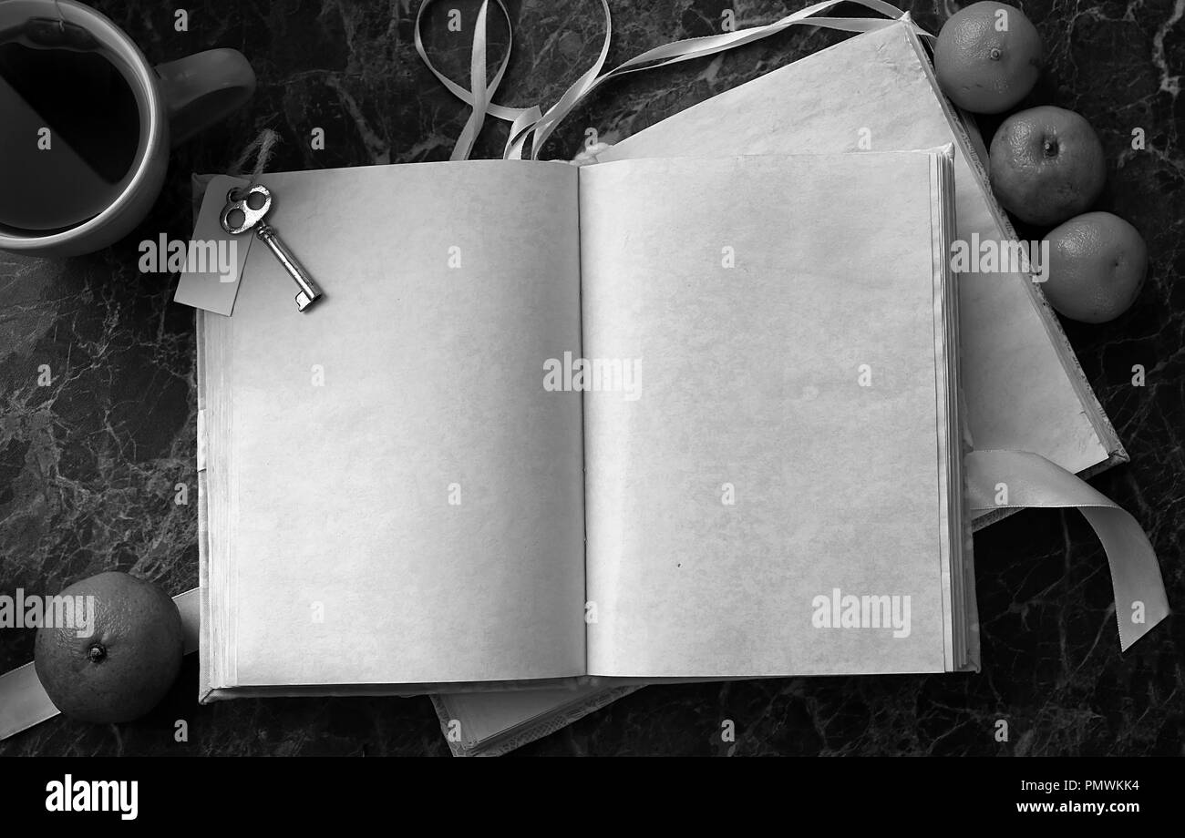 blank pages opened vintage book on the table Stock Photo - Alamy