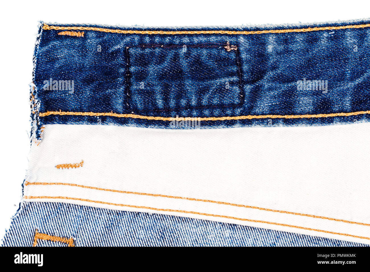 Piece of blue jeans and white fabric isolated on white background ...