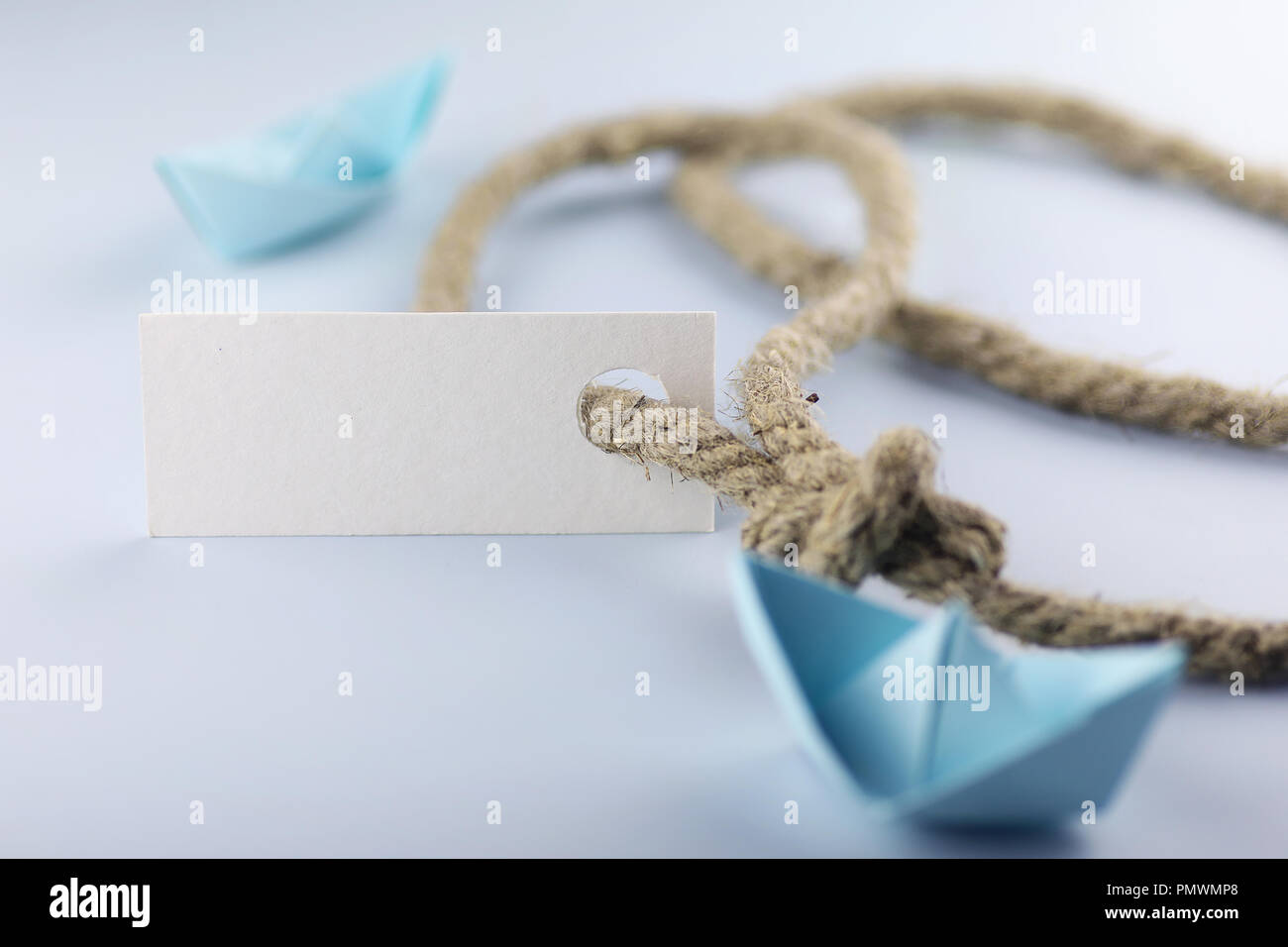 sticker with thick braided rope and ship paper origami Stock Photo - Alamy
