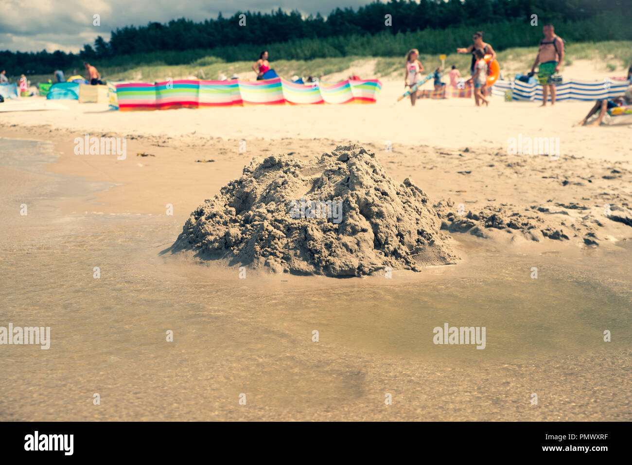 close up on destroyed sand castle on the beach Stock Photo - Alamy