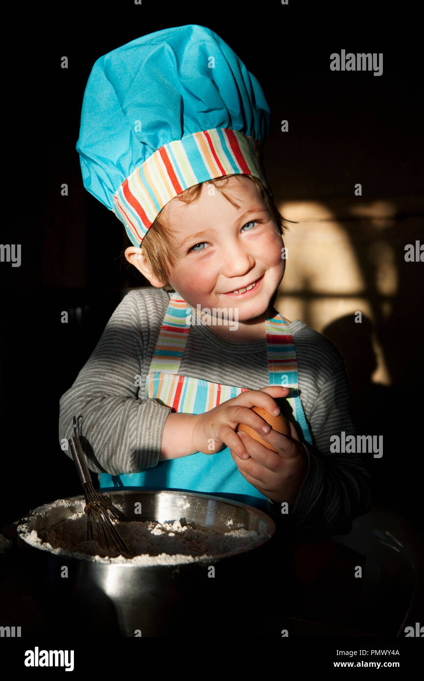 Portrait cute girl in chefs hat baking Stock Photo - Alamy