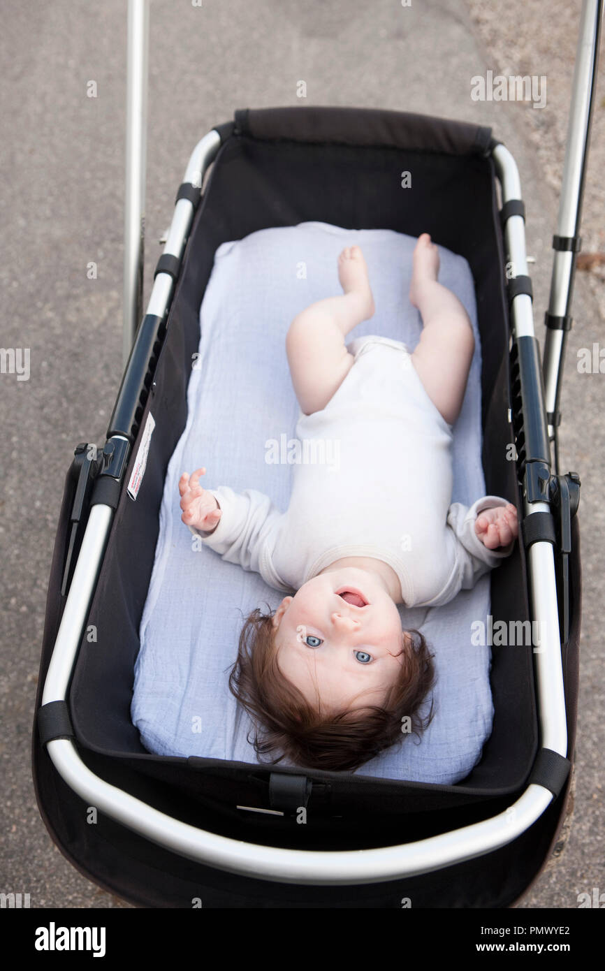 Portrait cute baby in stroller Stock Photo - Alamy
