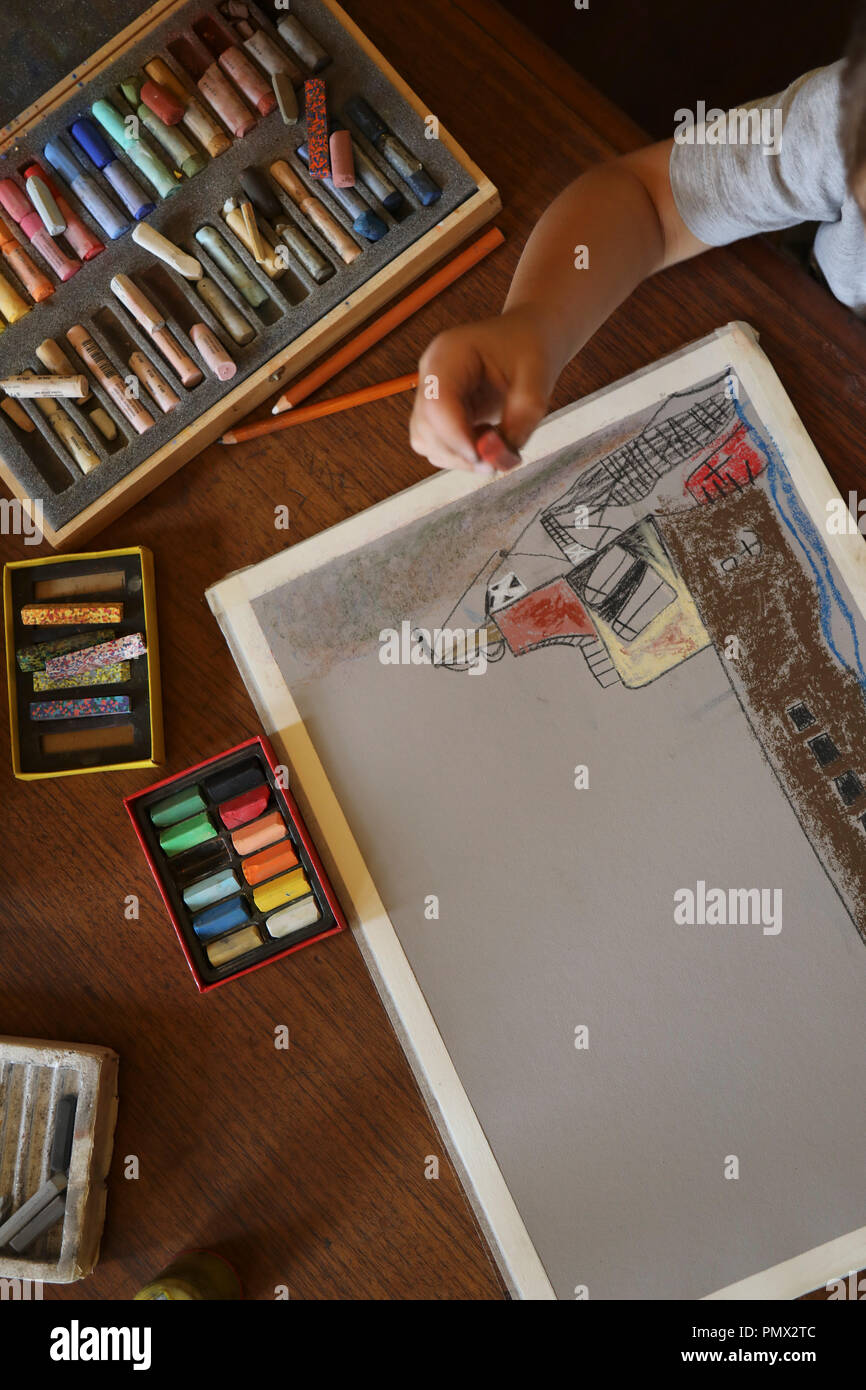 View from above boy drawing with chalk Stock Photo - Alamy