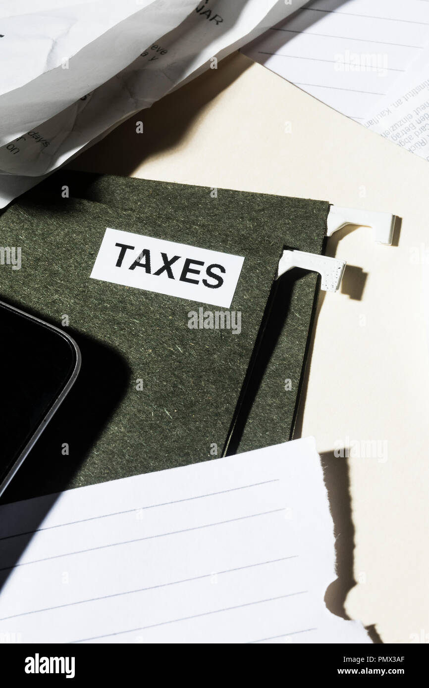 Close up taxes file and finance paperwork Stock Photo - Alamy