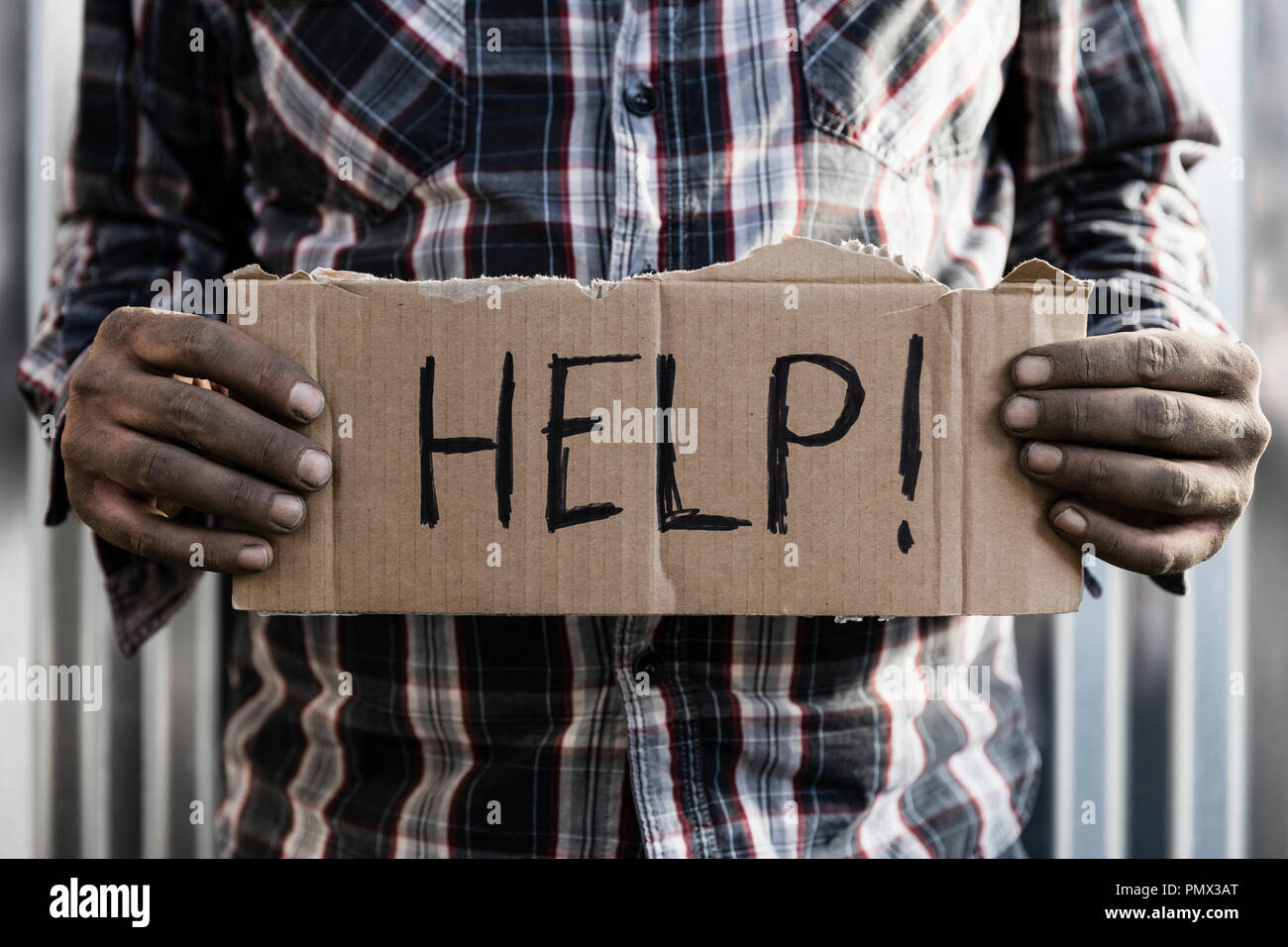 Homeless man holding cardboard sign hi-res stock photography and images ...