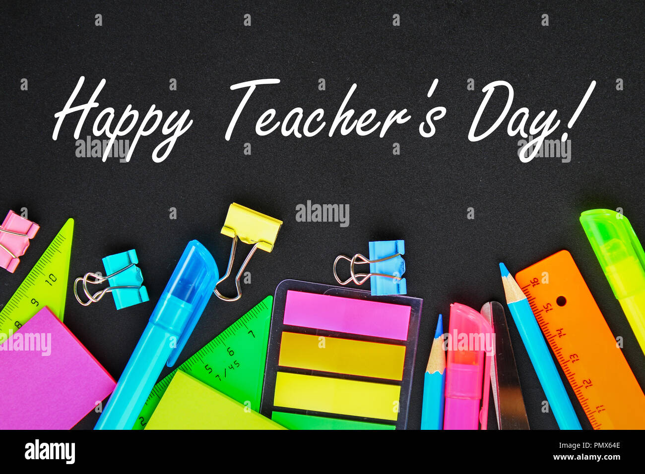 Happy Teachers Day. School supplies on blackboard background ready for ...