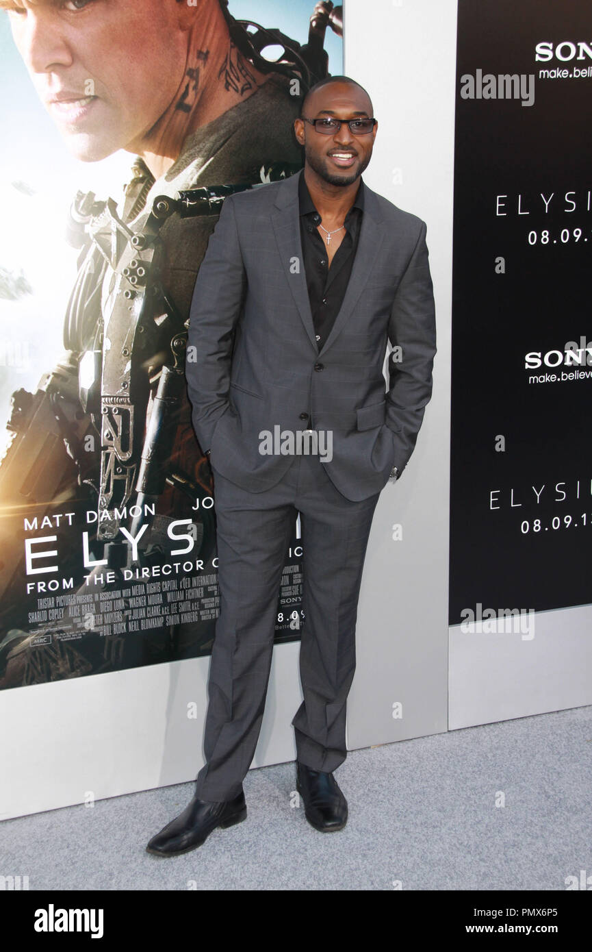 Adrian Holmes 08/07/2013 "Elysium" Premiere held at Regency Village ...