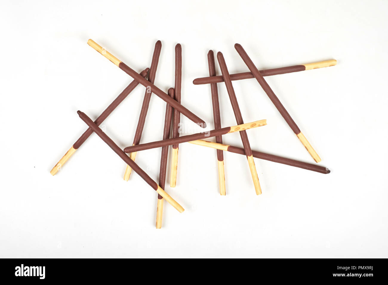 Biscuit sticks in chocolate coating on white background. Chocolate ...