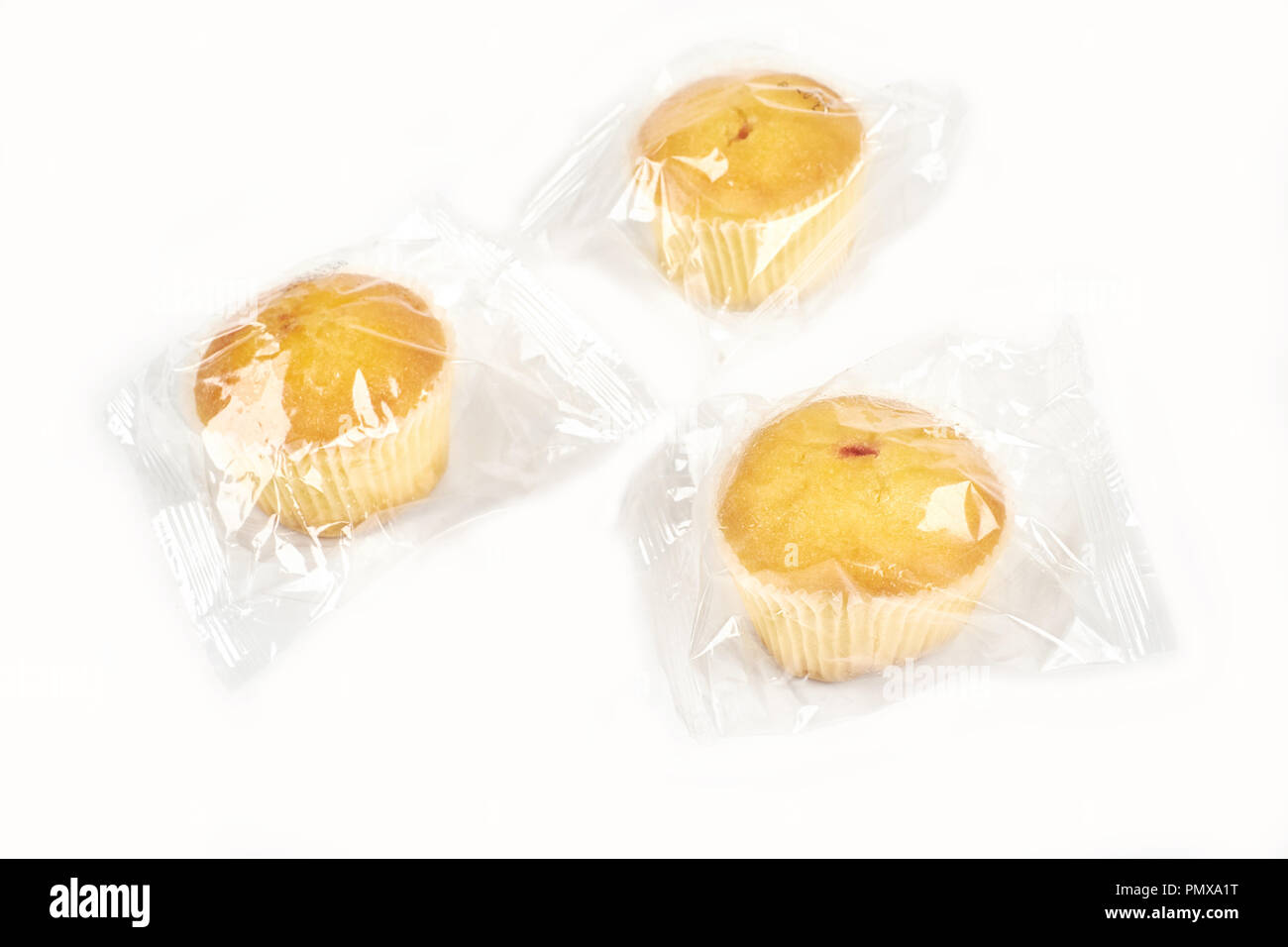 muffins packed in transparent packaging, on a white background Stock ...
