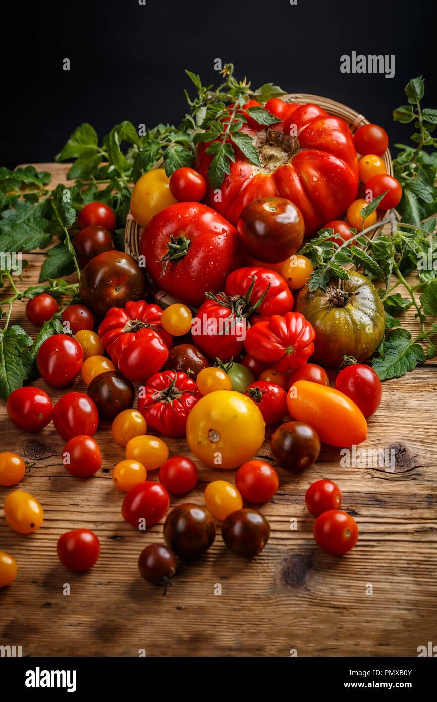 Organic assorted tomatoes background hi-res stock photography and ...