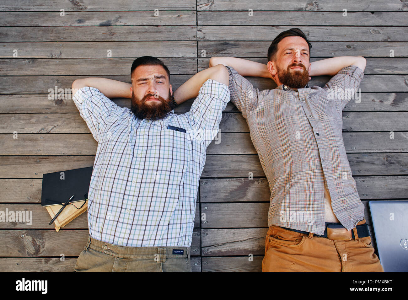 two businessmen in a break between work. He relaxes looking into the ...