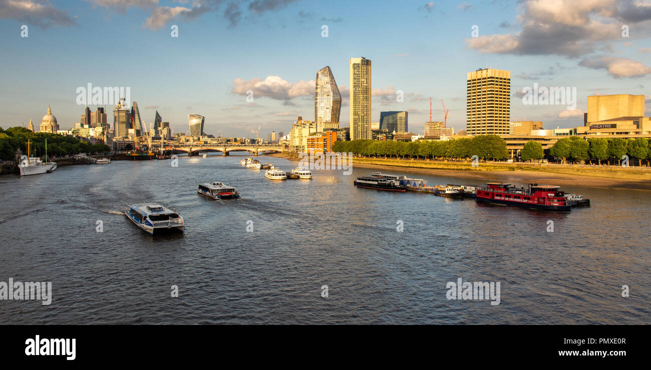 London, England, UK - June 12, 2018: Passenger ferries speed along the ...