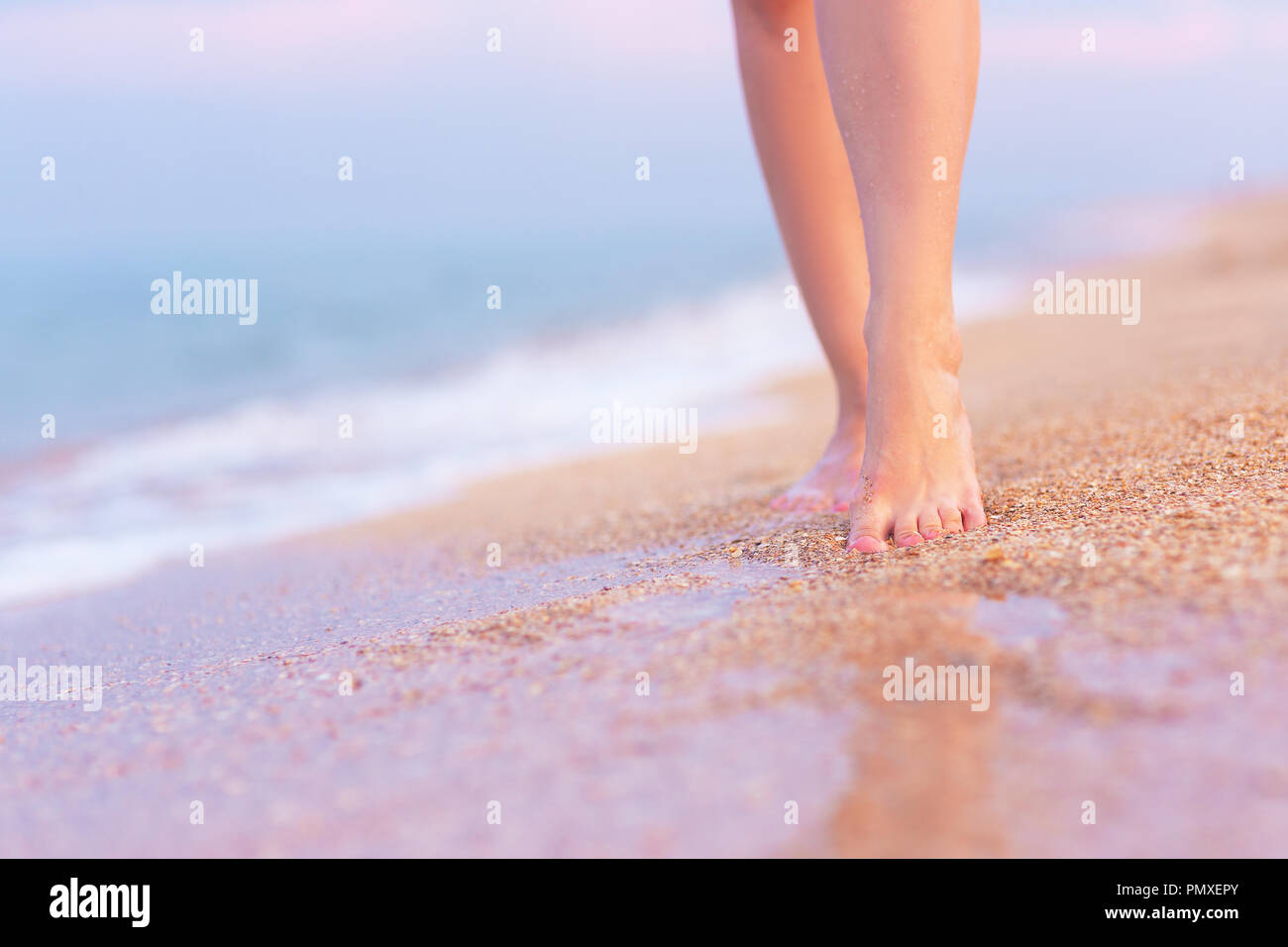 female legs walking on the sea beach. Summer vacation concept Stock ...