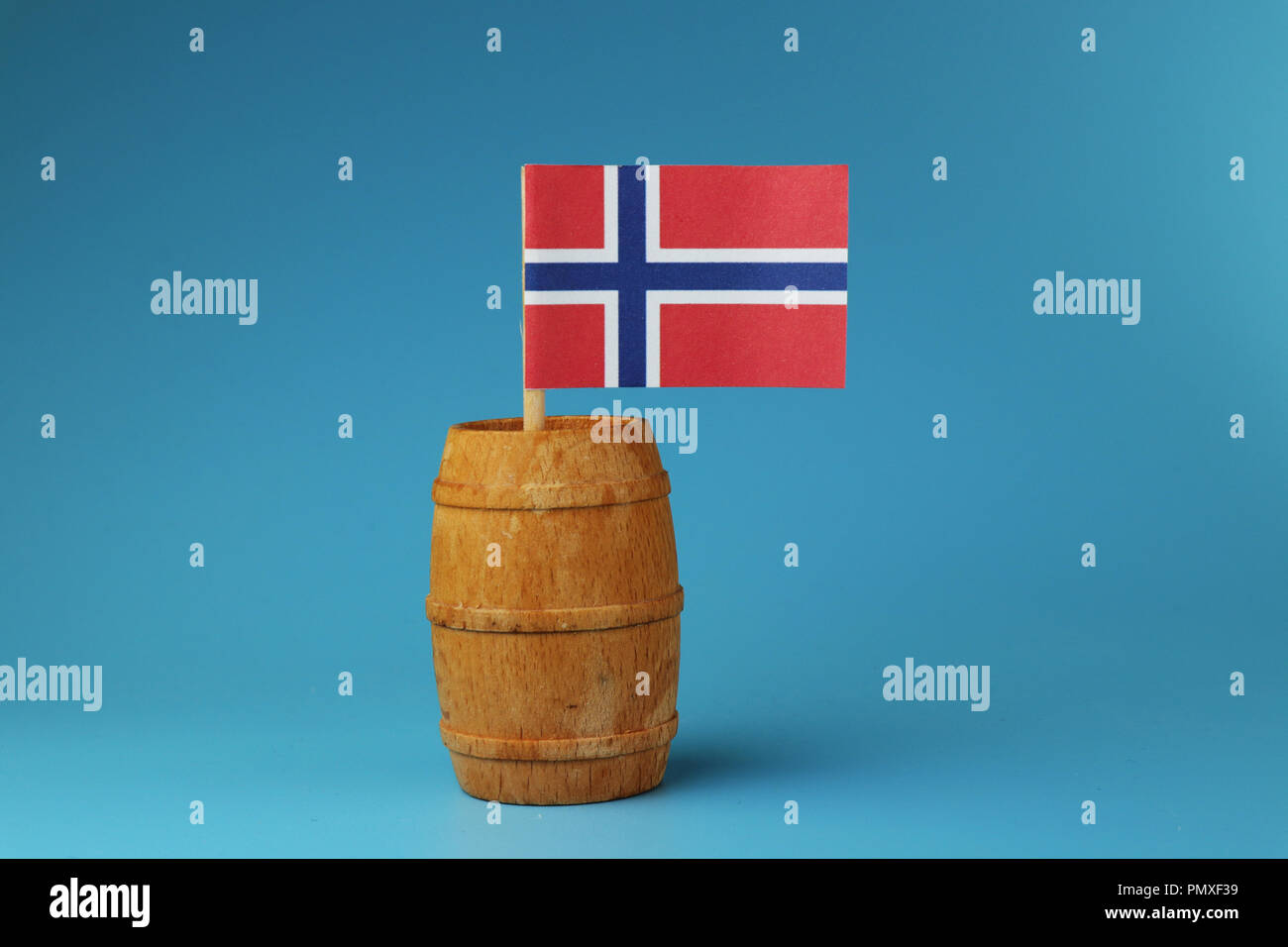 A blue and red national flag of Norway on wooden stick in wooden barrel ...