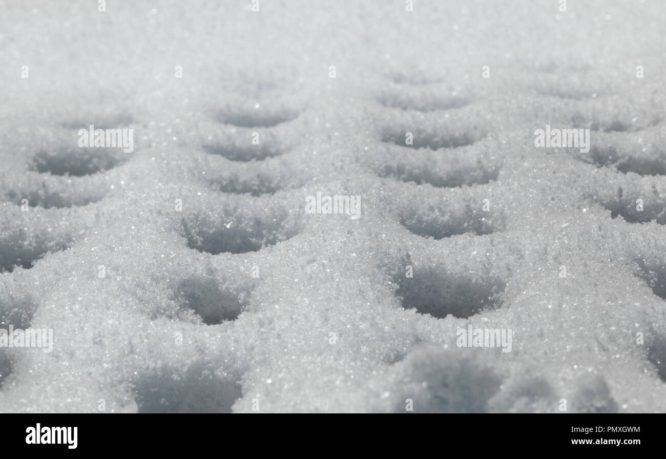 Snow creates a geometric shape , lines and empty squares , backlight ...