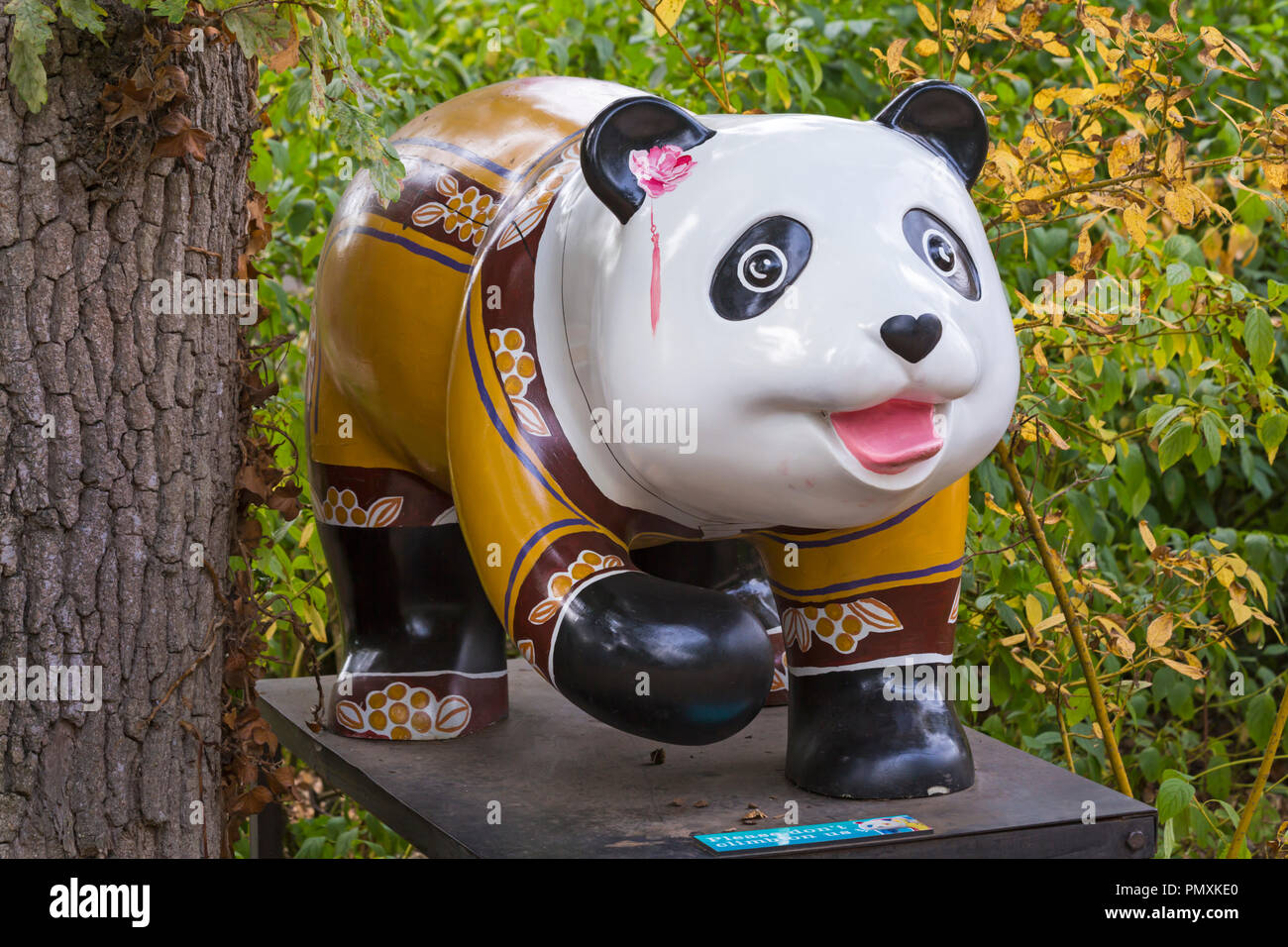 Pop-up panda - cute panda statue sculpture, forming part of an art ...