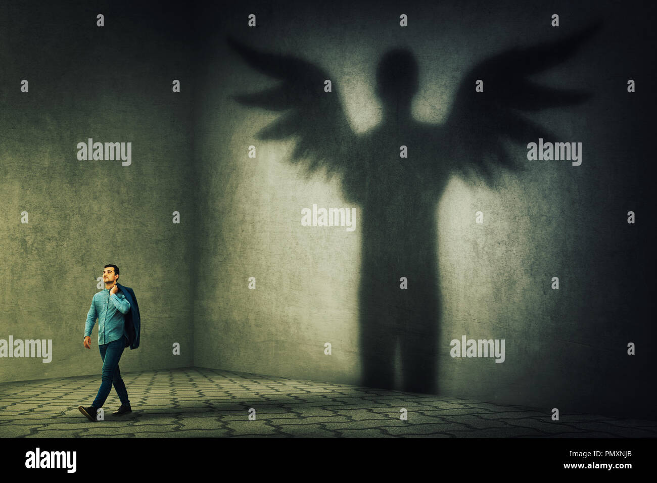 Proud and confident young businessman casting a superhero shadow with ...