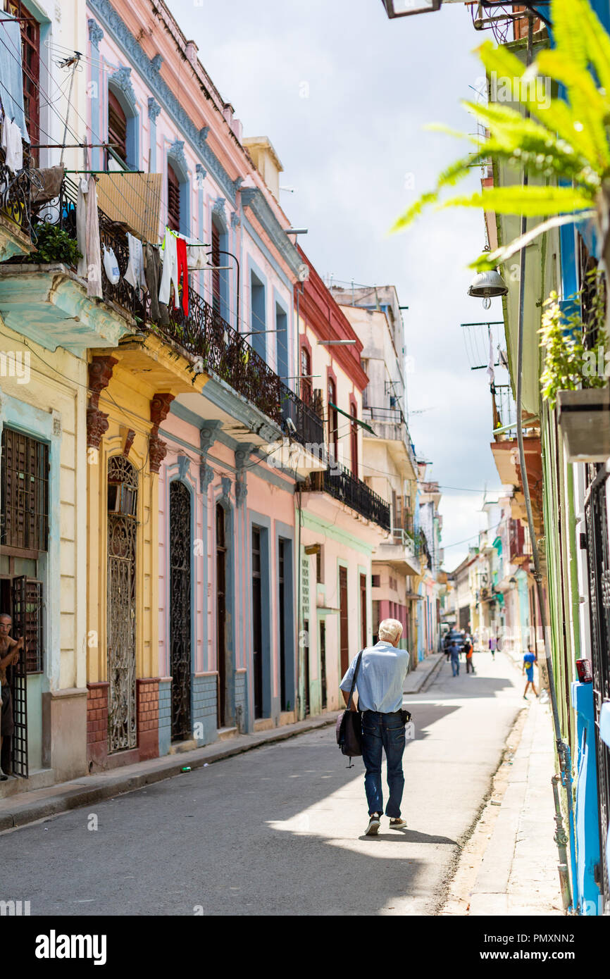 Cuban man walking down the street to work, Havana, Cuba Stock Photo - Alamy