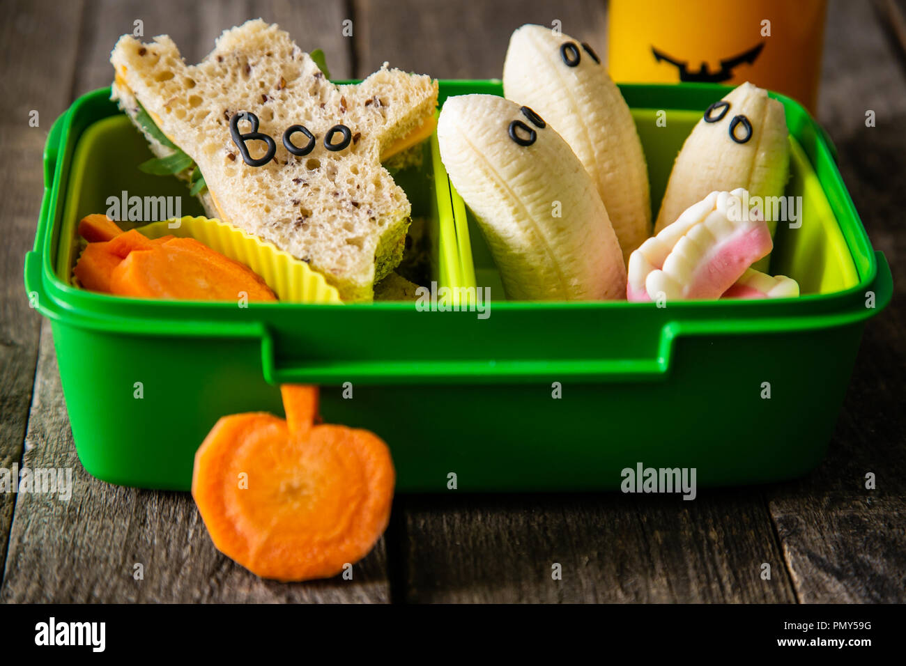 Halloween style school lunch box - ghost sandwich, pumpkin carrots ...
