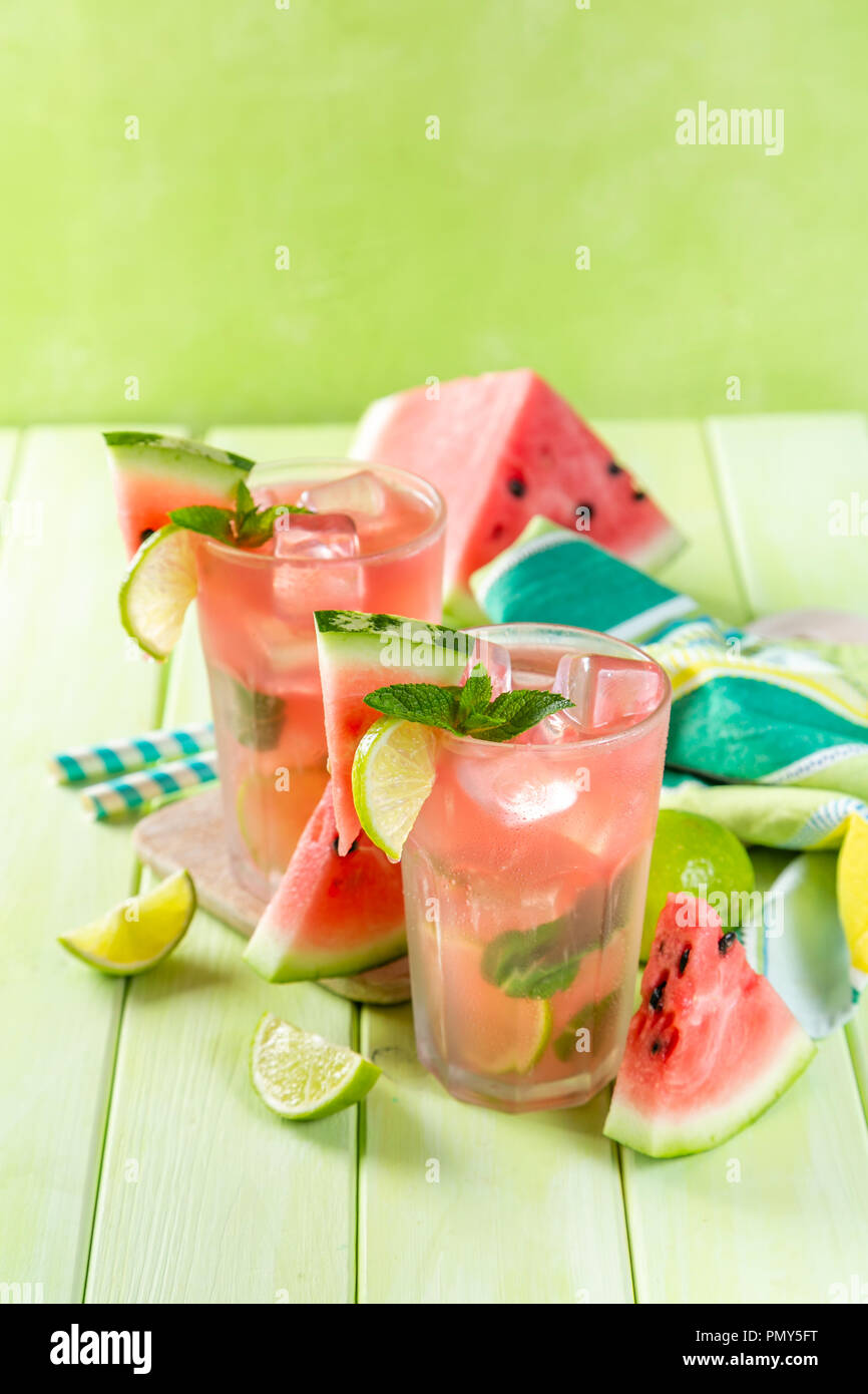 Watermelon lemonade with lime and mint, wood background Stock Photo - Alamy