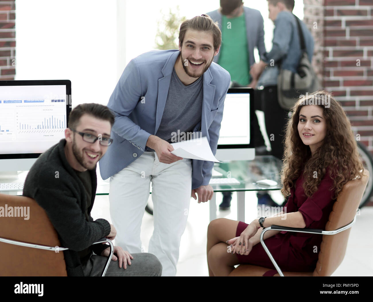 friendly business team talking in the office Stock Photo - Alamy