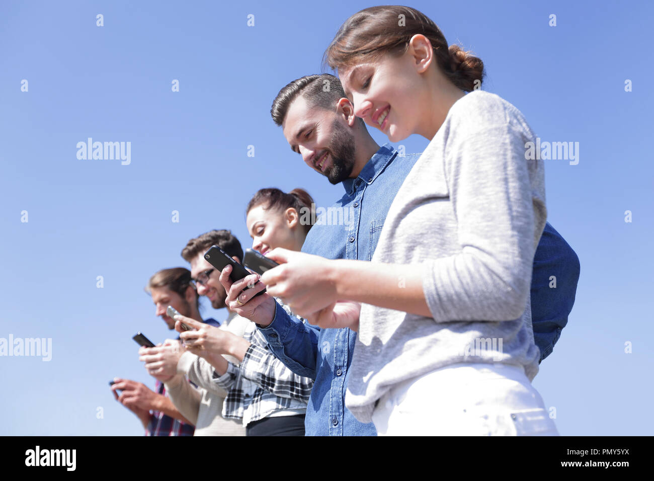 young people using smartphones to search network Stock Photo - Alamy