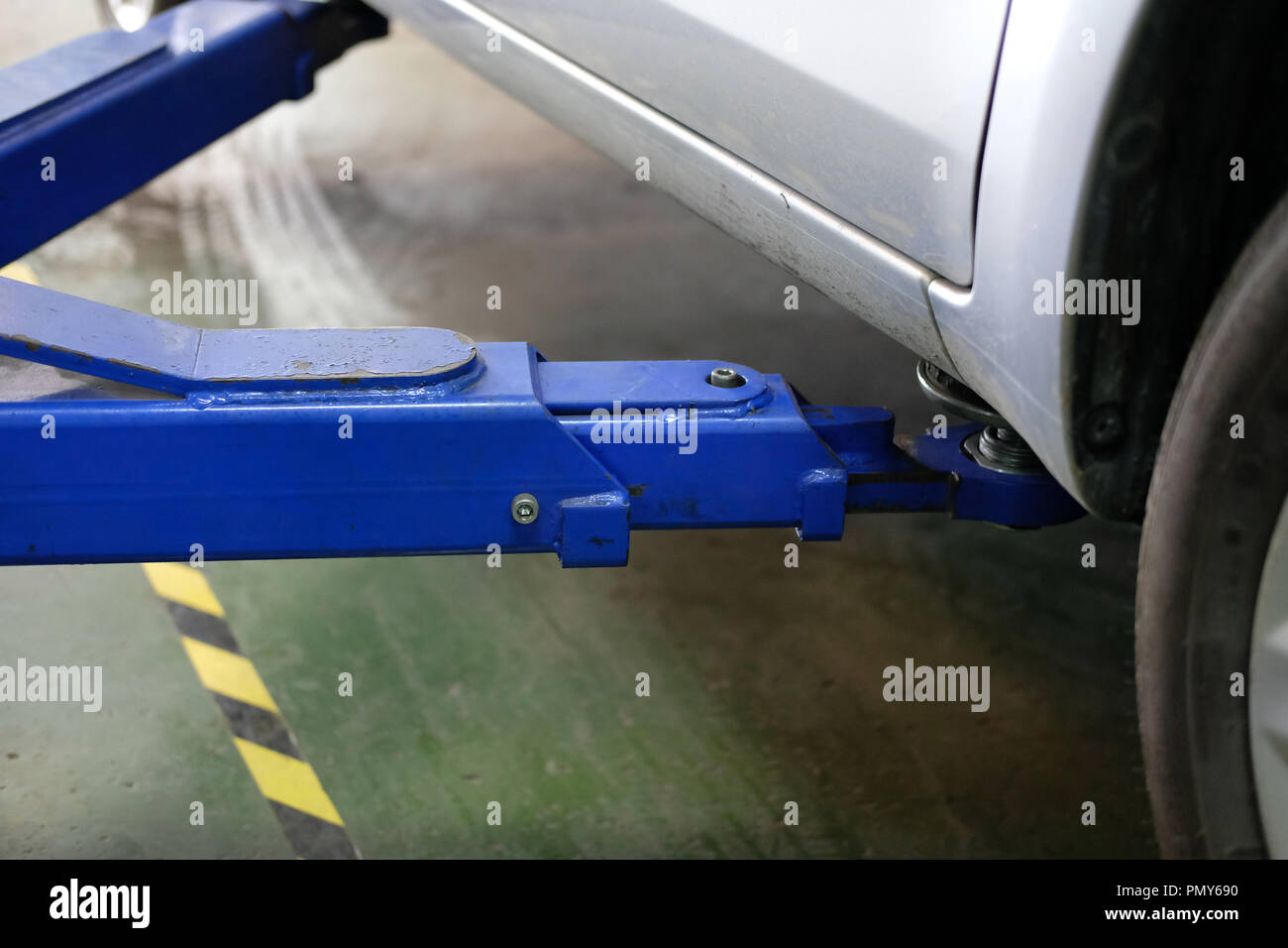 car on lift in automobile service repair garage Stock Photo - Alamy