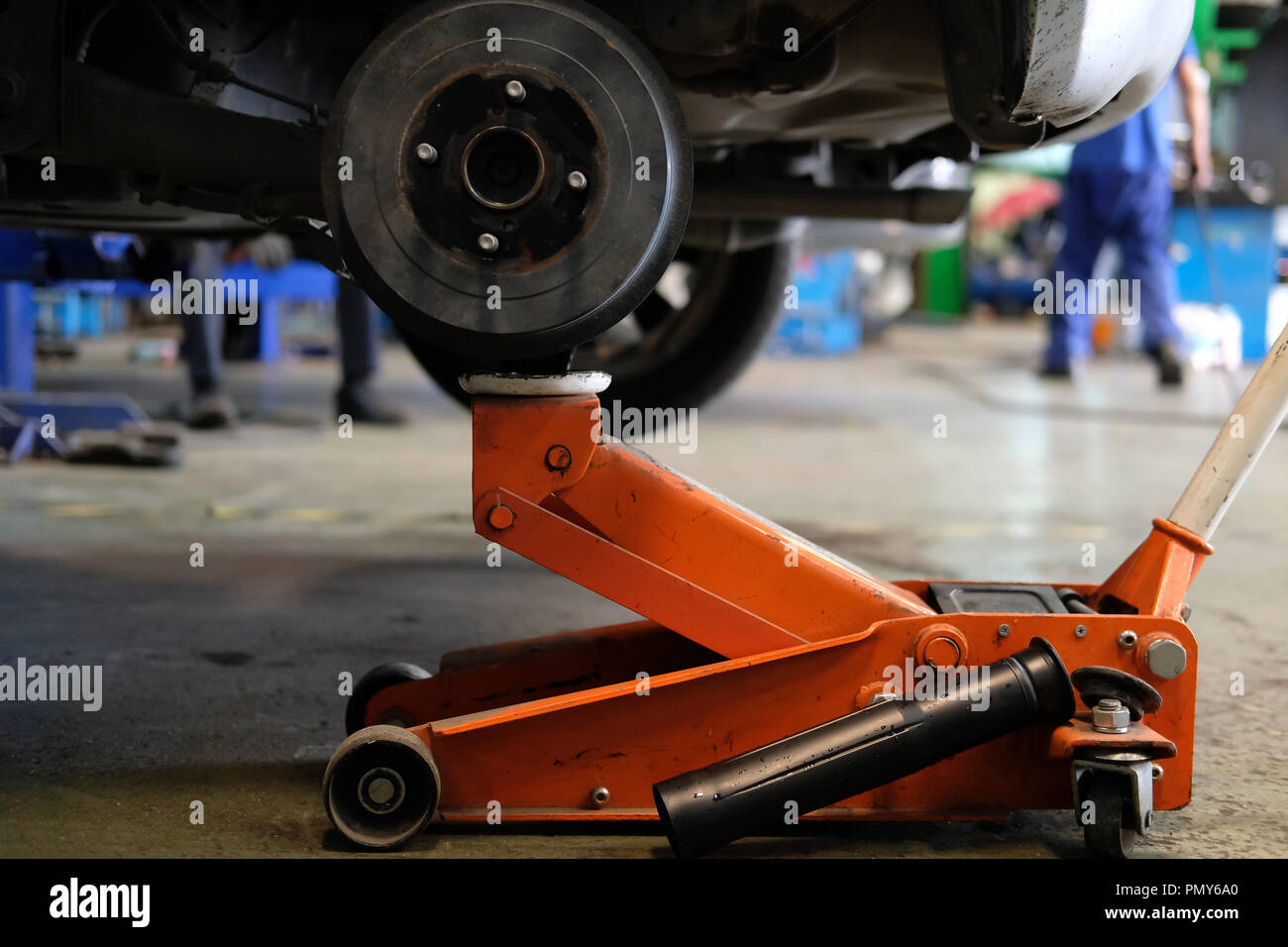 brake disc & wheel hub axle heck in auto service maintenance. Car lift ...