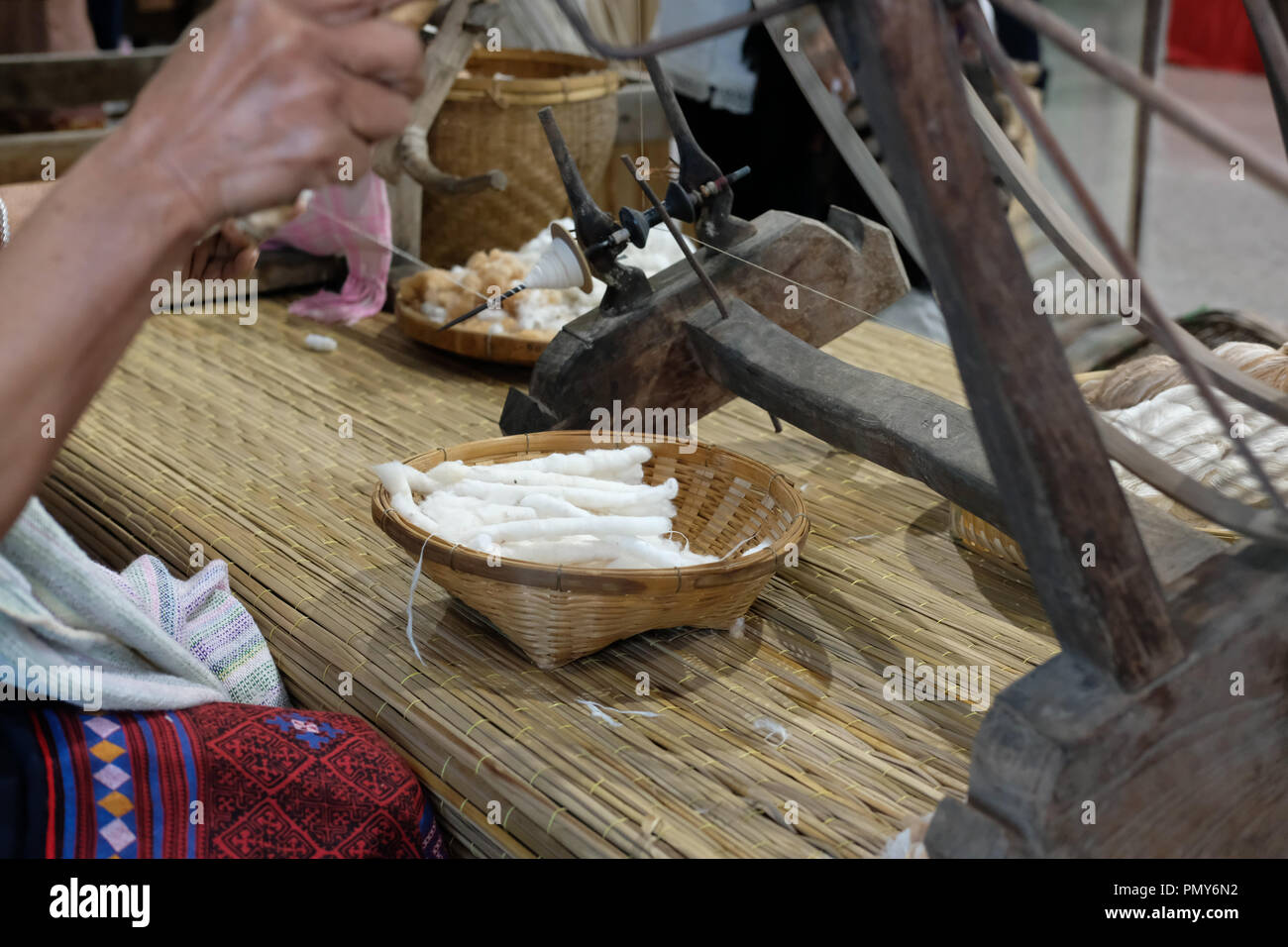 woman spinning cotton into thread with traditional ancient wheel Stock ...