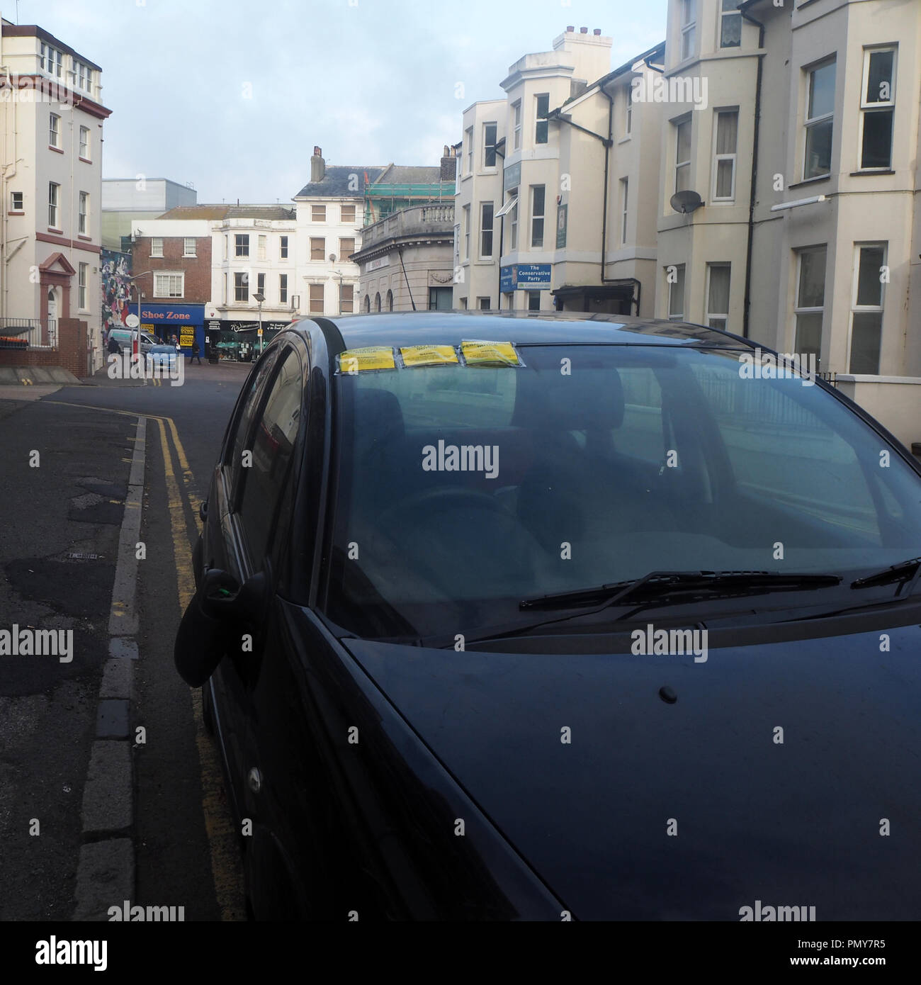 3 parking tickets on a car window Stock Photo - Alamy