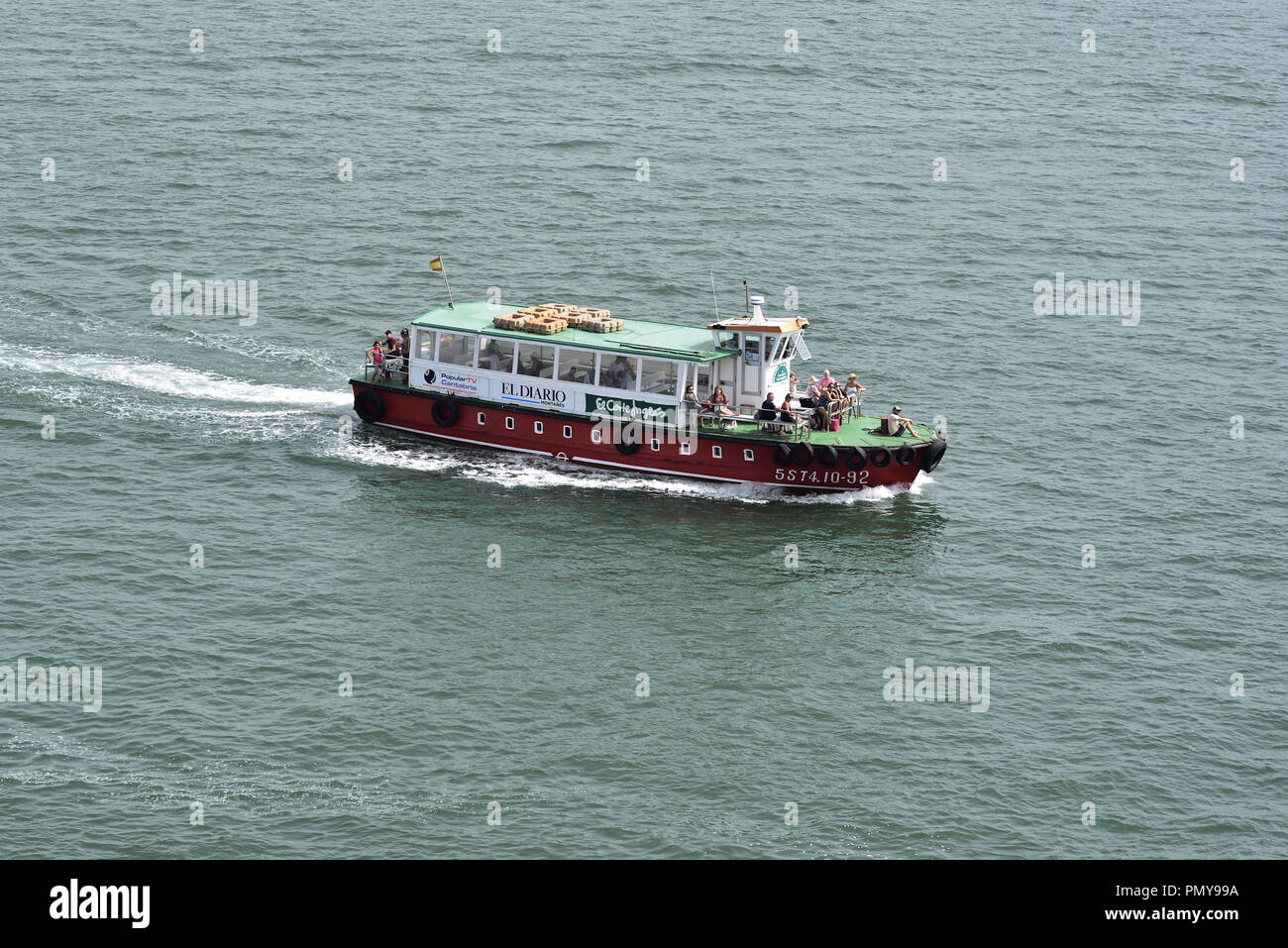 Pleasure boat heading towards Santander, seen from the deck of the ...