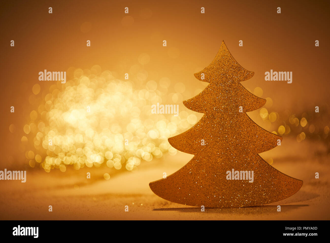 golden sparkling christmas tree for decoration on tabletop Stock Photo ...