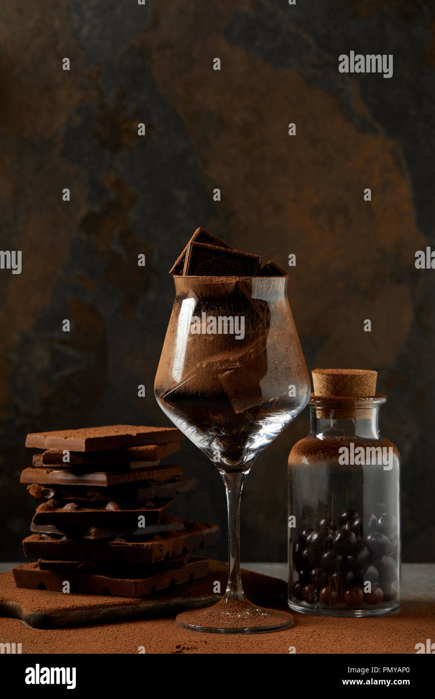 chocolate pieces in glass and delicious chocolate balls in glass jar ...