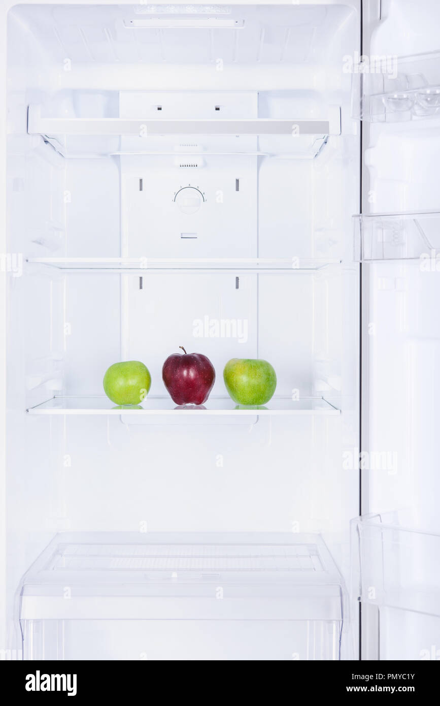 three ripe tasty apples in fridge Stock Photo - Alamy