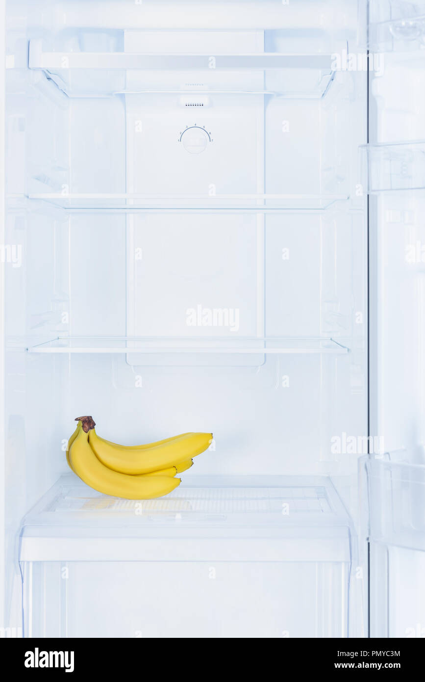 ripe appetizing bananas on shelf in fridge Stock Photo - Alamy