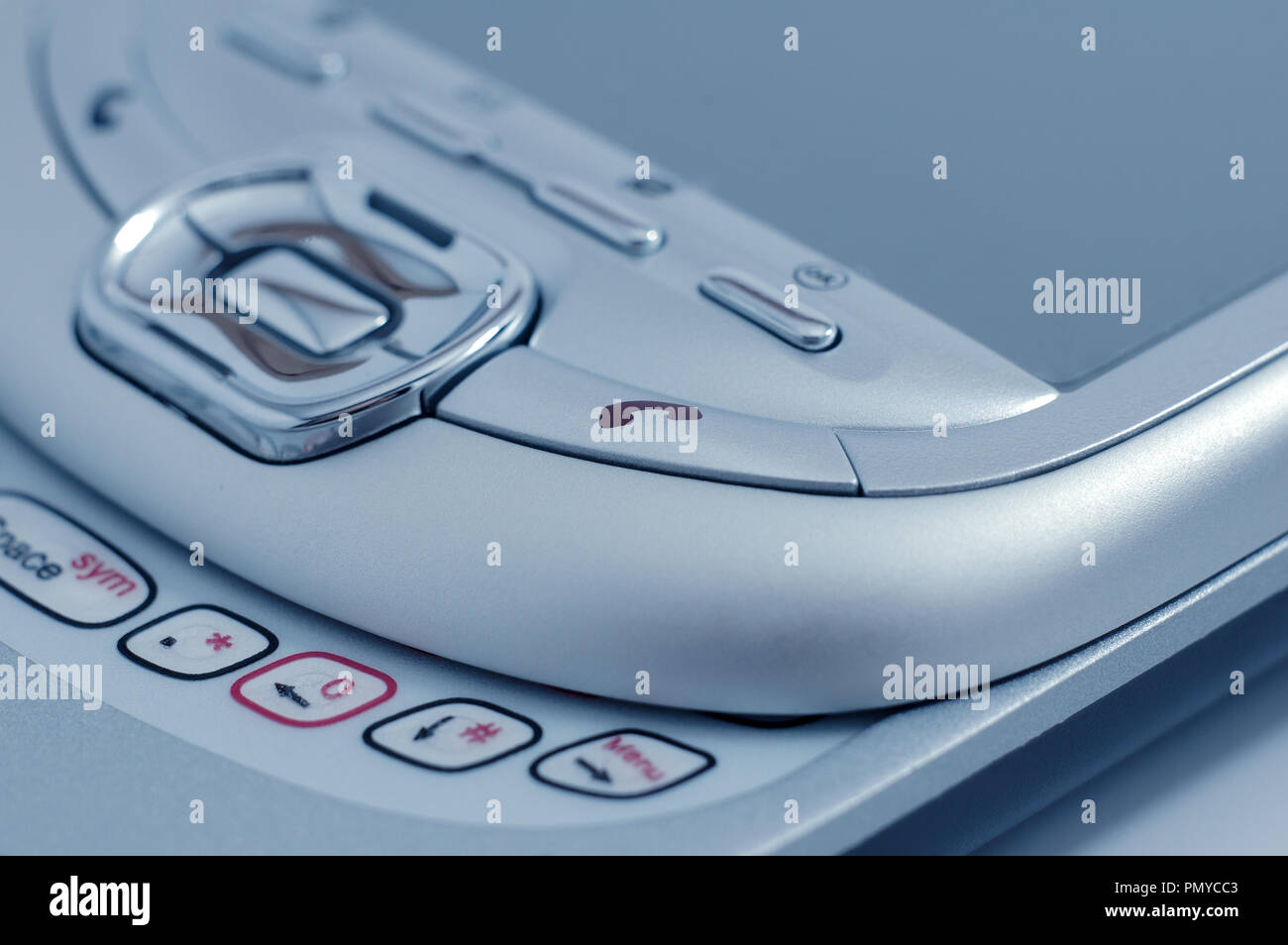 PDA. Old type mobile phone. Picture in blue tint Stock Photo - Alamy