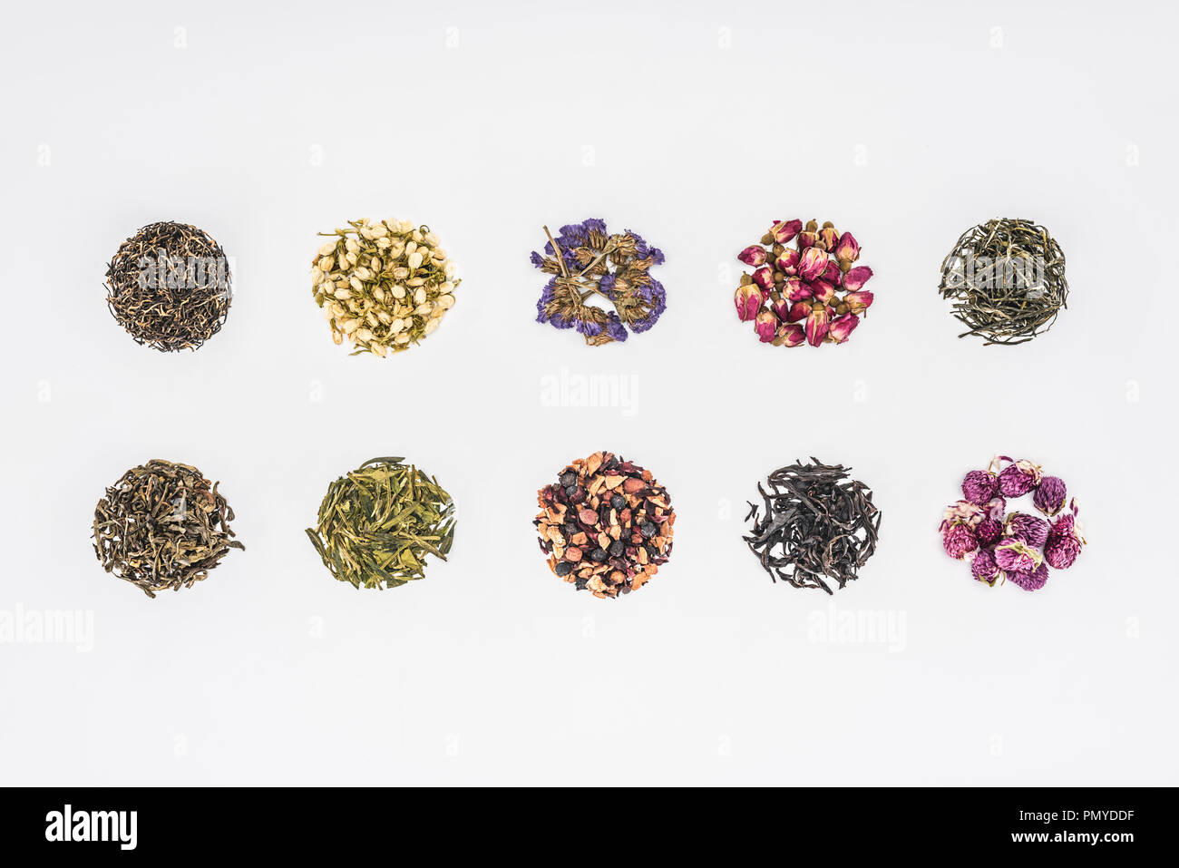 circles of dried herbal organic tea in lines isolated on white Stock ...