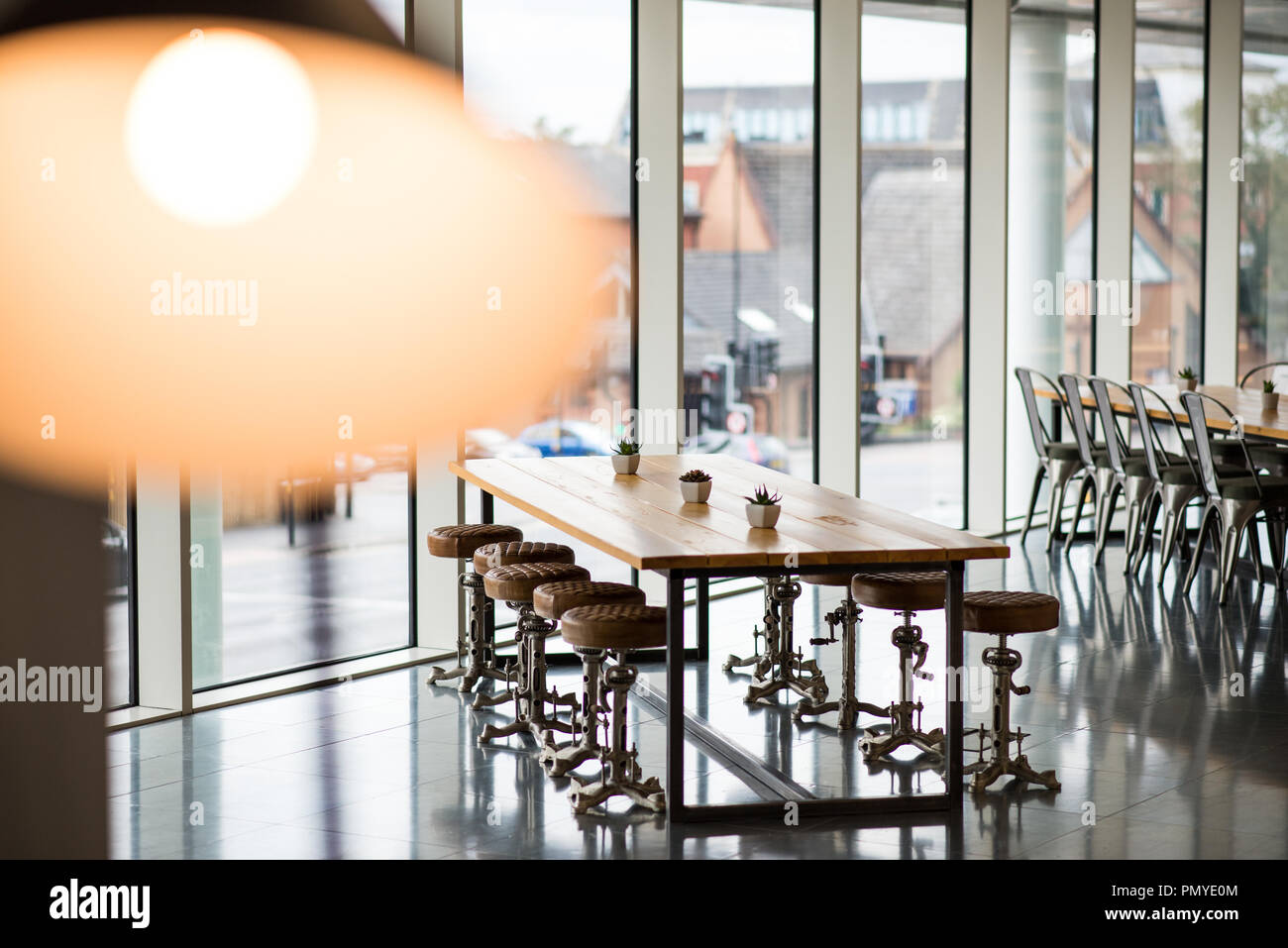Open plan office seating on benches Stock Photo - Alamy