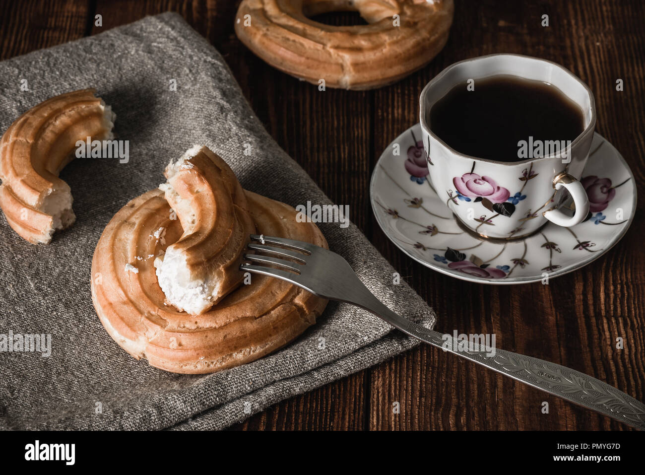 Coffee Break with Eclairs. Stack of Eclairs on the Foreground Stock ...