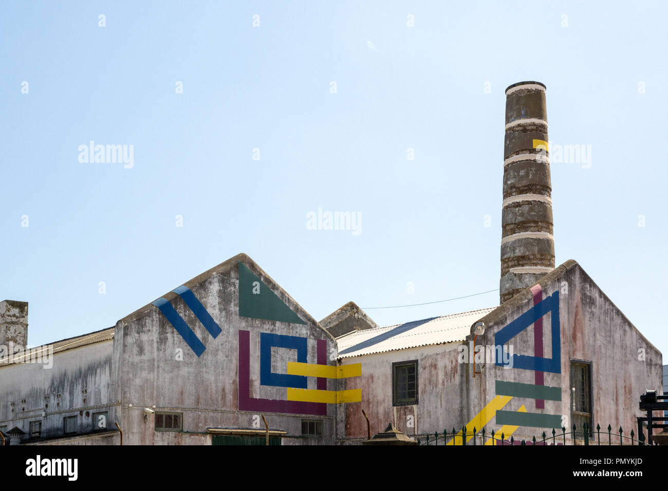 A concrete factory building painted in bold primary colours hi-res ...