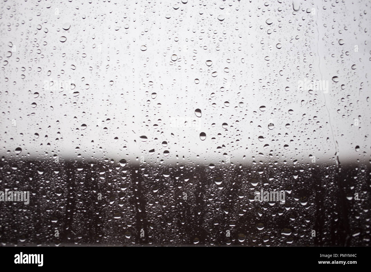 Window view blurry with heavy rain, natural raindrops on glass Stock ...