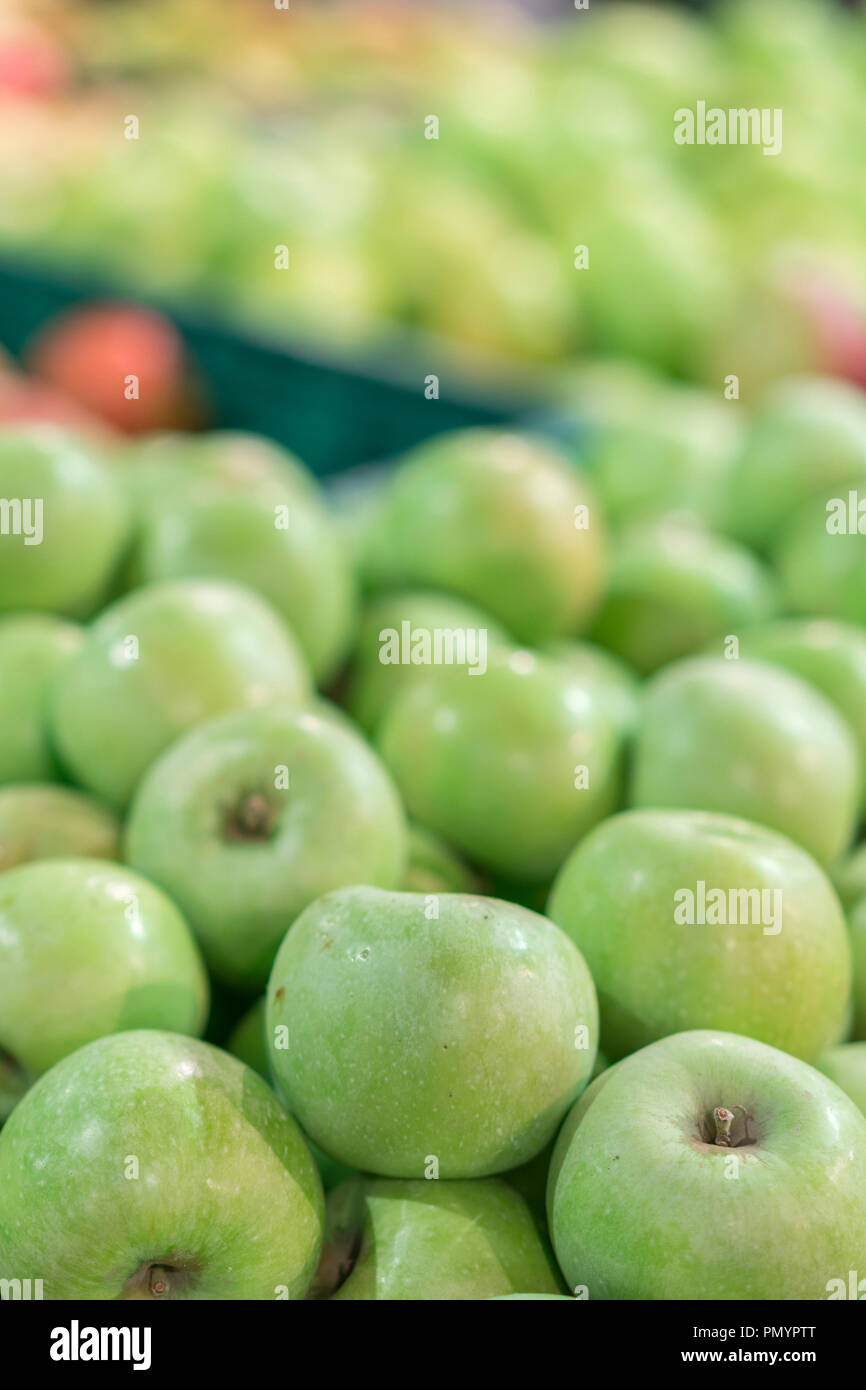 Green apples in a box in the store. green apples in boxes on market ...