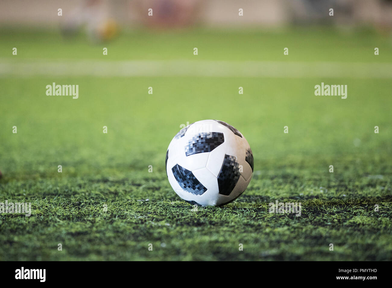 Traditional soccer ball on soccer field grass Stock Photo - Alamy