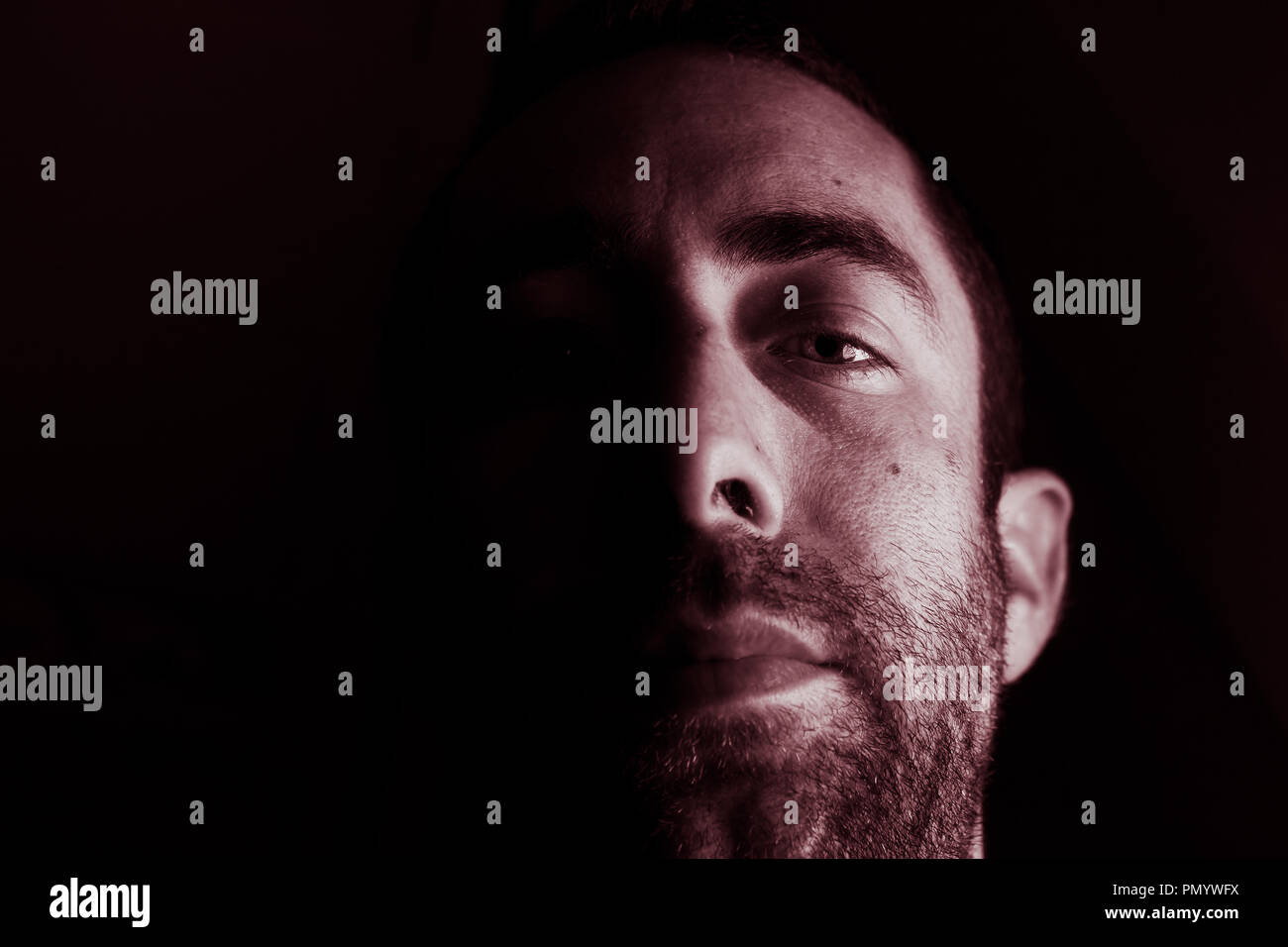 Man looking down shadow face close up hi-res stock photography and ...