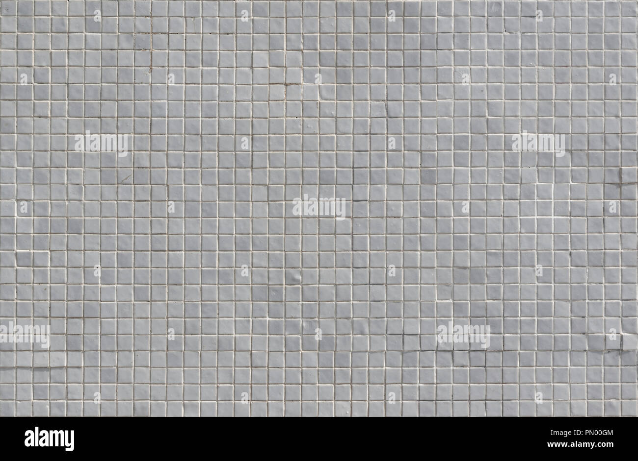 Small white tiles on the wall texture Stock Photo - Alamy
