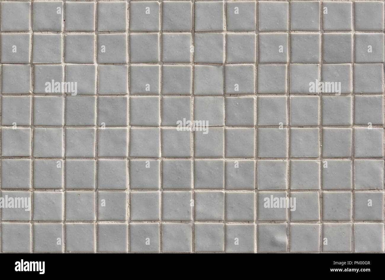 Small white tiles on the wall texture Stock Photo - Alamy