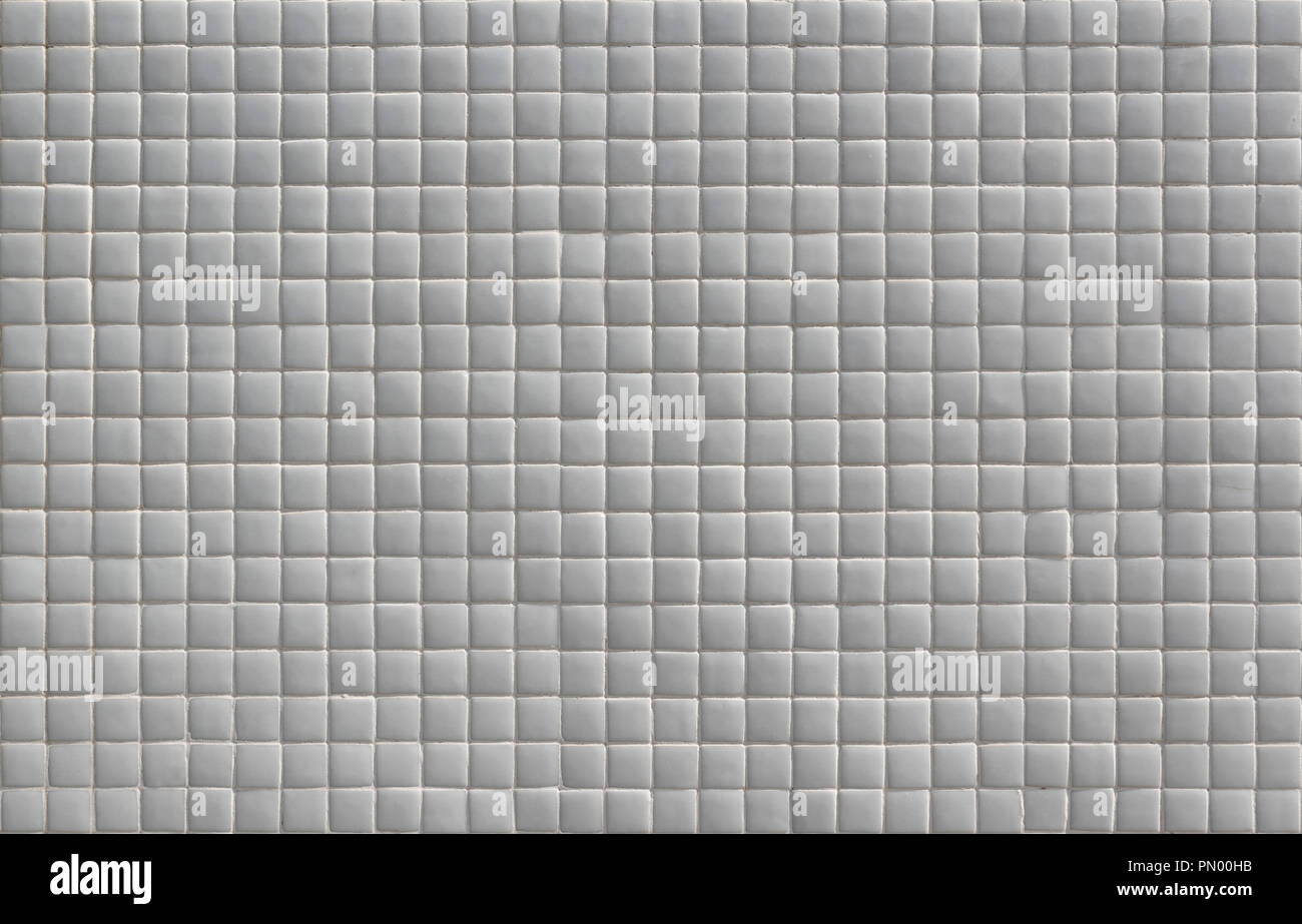 Small white tiles on the wall texture Stock Photo - Alamy