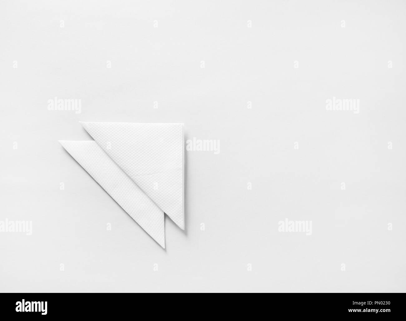 Blank white folded napkins on paper background with copy space. Flat ...