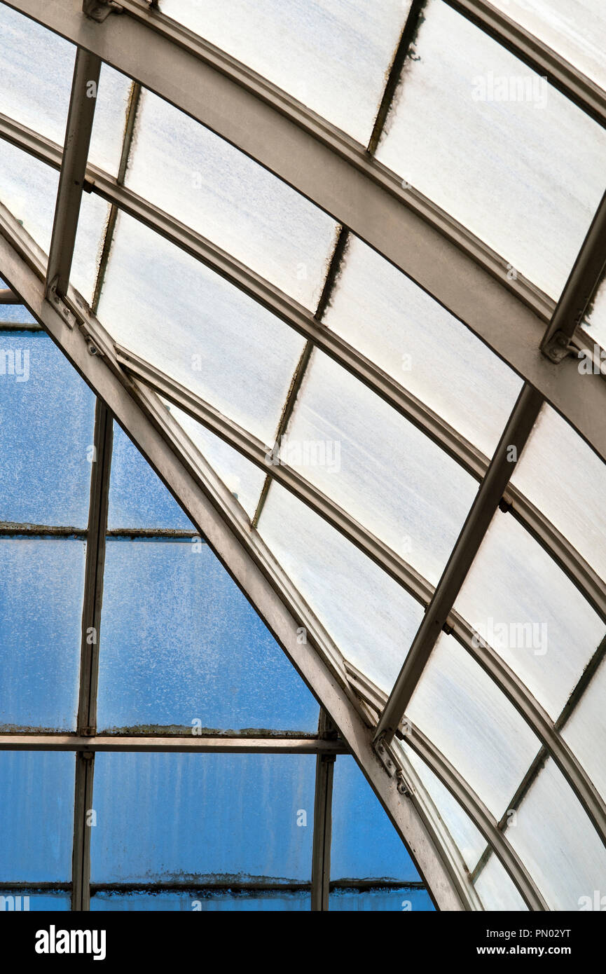 Greenhouse windows with arch and glass in metal framing Stock Photo - Alamy